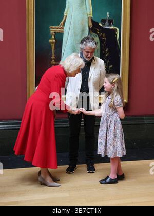 Queen Camilla (centre) meets with Paul S. Benney during a visit to the ...