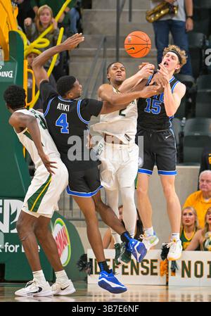 BYU guard Richie Saunders (15) shoots the ball over Wisconsin guard ...
