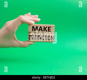 Make distinction symbol. Concept words make distinction on wooden ...