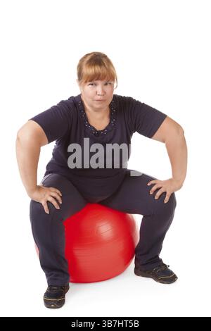 Fat woman with big red gimnastic ball Stock Photo - Alamy