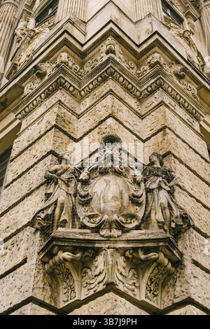 Female face relief on the walls of the building Stock Photo - Alamy