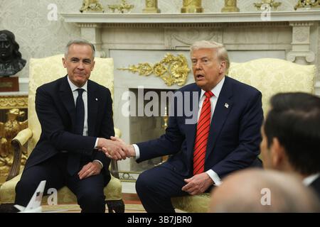 Prime Minister Mark Carney shakes hands with Joel Lightbound, Minister ...