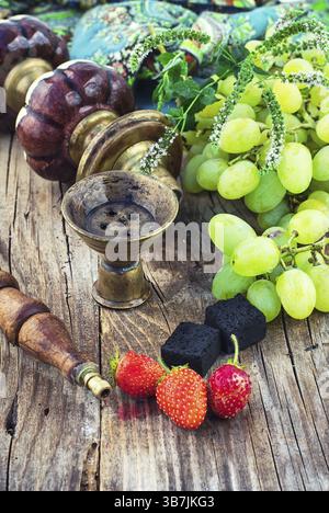 Turkish hookah with shisha tobacco with grape flavor.Space for text ...