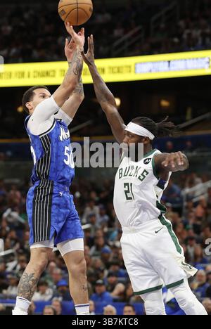 Milwaukee Bucks' Cole Anthony shoots past Washington Wizards' Cam ...