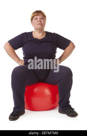 Fat woman with big red gimnastic ball Stock Photo - Alamy