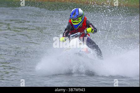 Jet Ski racer cornering at speed creating at lot of spray Stock Photo ...