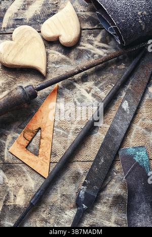 Symbolic wooden hearts cut by hand and carpenter tools Stock Photo - Alamy