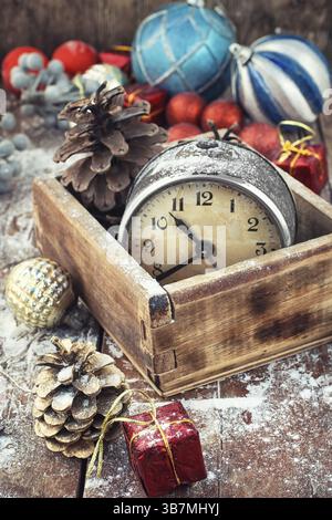 Retro style clock with christmas decorations Stock Photo - Alamy