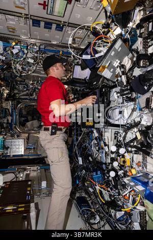 In this image provided by NASA, SpaceX capsule carrying four astronauts ...