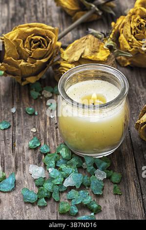 sea aromatic salt for Spa treatments on the background of yellow rose ...