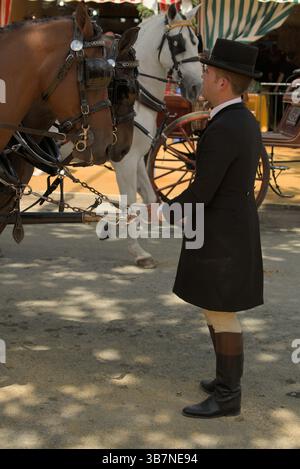 Elegant carriage parade during La Feria de Sevilla 2025, featuring ...