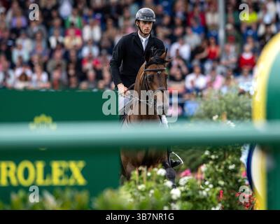 Richard Vogel of Germany rides United Touch S during the FEI Jumping ...
