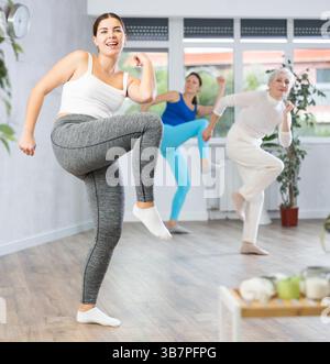 Different ages women learning swing steps at dance class Stock Photo ...