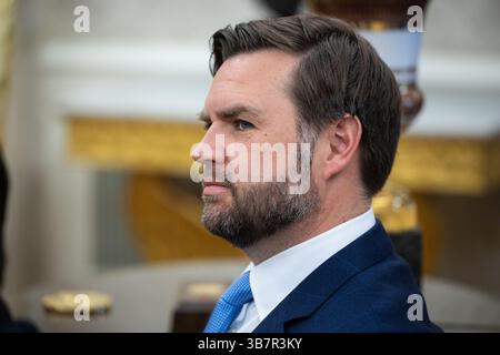 Prime Minister Mark Carney looks on as Mark Miller is sworn in as ...