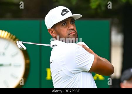 Tony Finau watches his tee shot on the night hole during the first ...