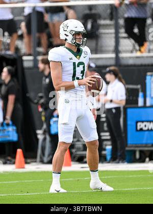 Baylor quarterback Sawyer Robertson (13) eludes SMU defensive end ...
