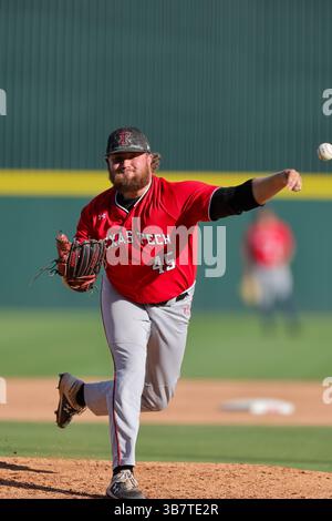 April 17, 2024: Red Raiders catcher Kevin Bazzell #4 lifts up his mask ...