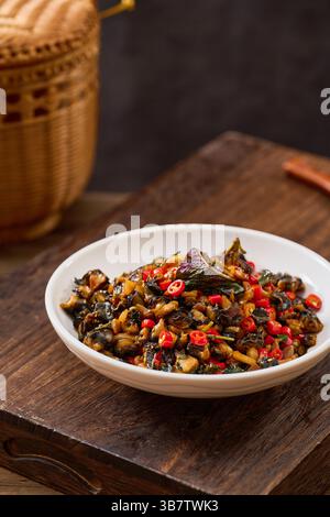 Stir fried snails with chili sauce Stock Photo - Alamy