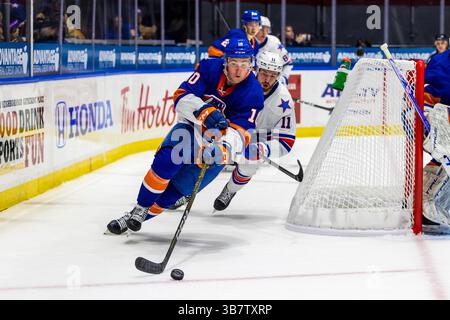 New York Islanders' Kyle MacLean (32) watches the puck against the ...
