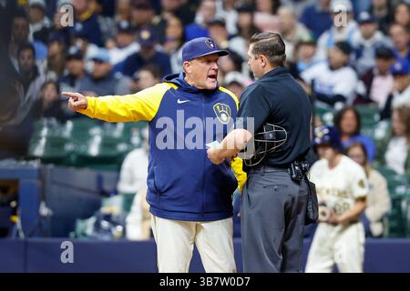 Milwaukee Brewers manager Pat Murphy argues with umpire Jim Wolf during ...