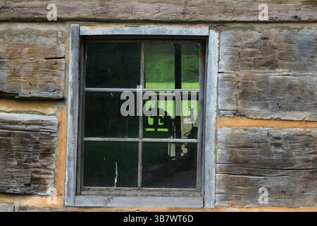 A reconstructed 19th-century American pioneer log cabin at Fowler Park ...