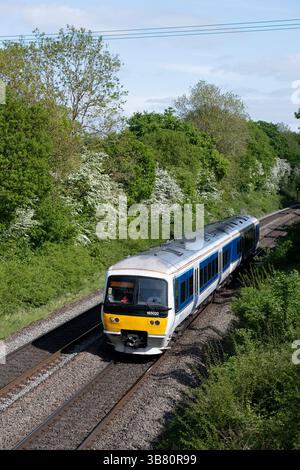 Chiltern Railways class 165 diesel train in Warwickshire countryside in ...