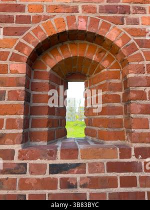 Scenic view through loophole of old fortress Kalaja to mediterranean ...