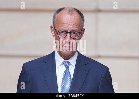 German Chancellor Friedrich Merz, second from left, talks with Sen ...