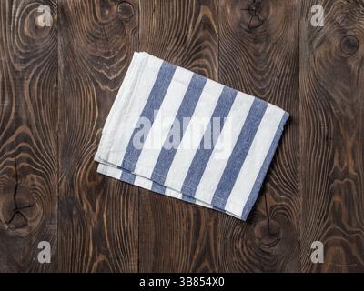 Perspective view of brown tablecloth for food on cement background ...