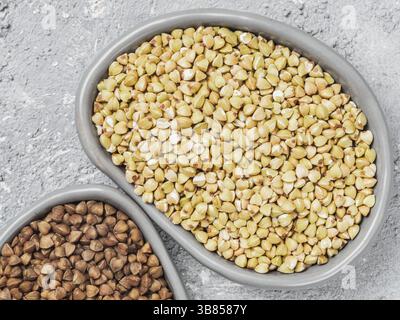 Raw green buckwheat on gray background Stock Photo - Alamy