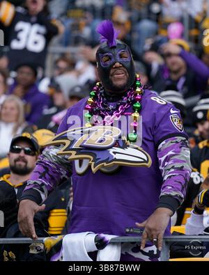 A Baltimore Ravens fan and a Pittsburgh Steelers fan talk during ...