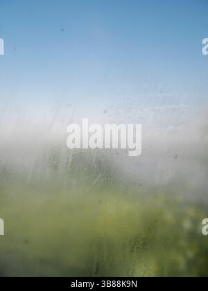 Water drops and condensed stem on glass at summer sunny day ...