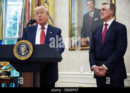 U.S. Ambassador to China David Perdue, right, shakes hands with Beijing ...