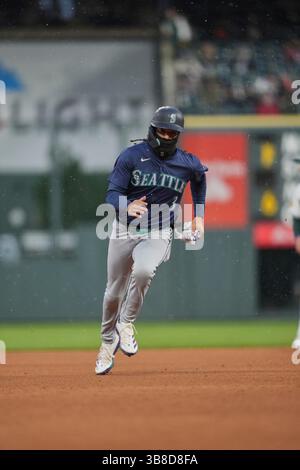 Seattle Mariners shortstop J.P. Crawford throws to first base for an ...