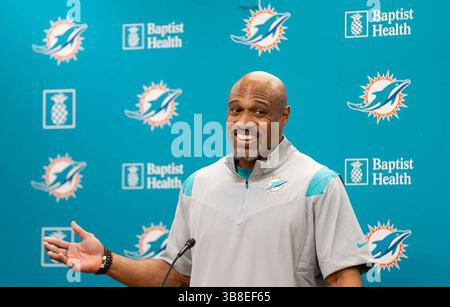 Miami Dolphins defensive coordinator Anthony Weaver walks to the locker ...