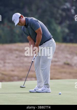 Tom Kim, of South Korea, hits his tee shot on the 14th hole during the ...