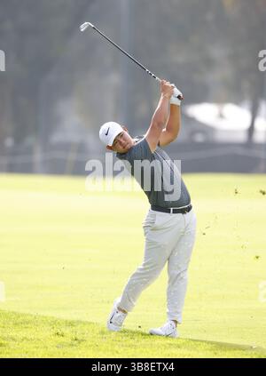 Tom Kim, of South Korea, hits his tee shot on the 14th hole during the ...