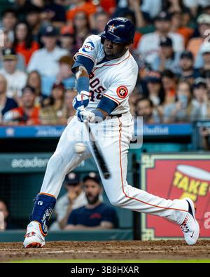 Houston Astros' Yordan Alvarez (44) hugs Jeremy Peña (3) after hitting ...