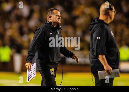 Coastal Carolina head coach Tim Beck, right, argues a call with side ...