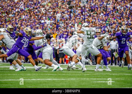 Oregon punter Ross James (92) holds an orange after the 2026 Capital ...