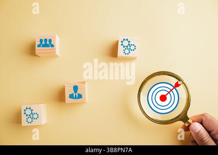 Target icon under magnifying glass Stock Photo - Alamy