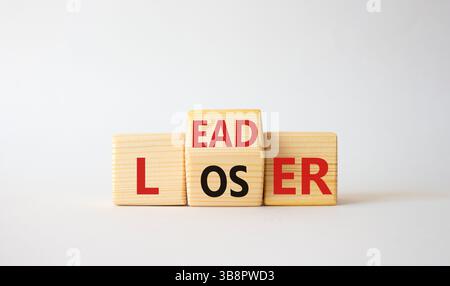Loser or leader symbol. Concept words Loser or leader on wooden cubes ...