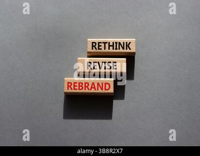 Rethink, revise, rebrand symbol. Wooden blocks with words 'rethink, revise, rebrand'. Beautiful ...