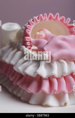Birthday cake with mastic and little baby in bed Stock Photo - Alamy