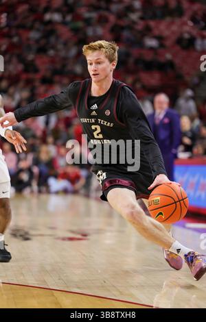 Texas A&M guard Hayden Hefner (2) is fouled by Auburn guard Chad Baker ...