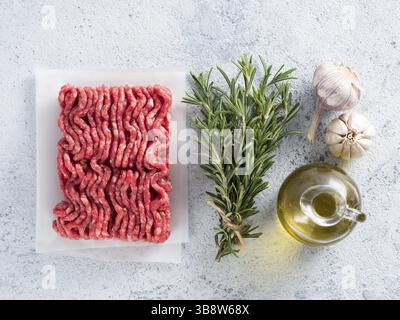 Raw minced meat over light background. Top view, flat lay Stock Photo ...