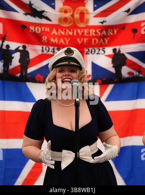 An entertainer sings and dances at a tea party at Erskine Veterans Home ...