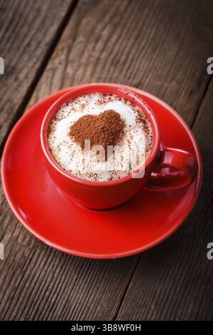 Valentine's day concept with red mugs, chalk inscription and red felt ...