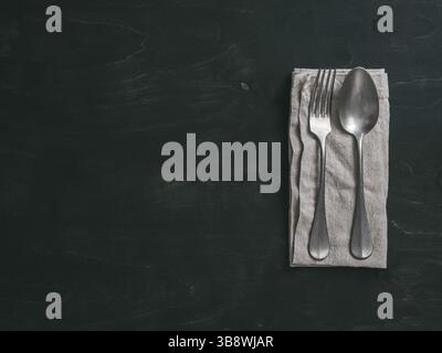 Perspective view of empty black plate on wooden background. Empty space ...