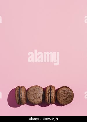 Row of colorful french macarons over yellow background. Sweet dessert ...